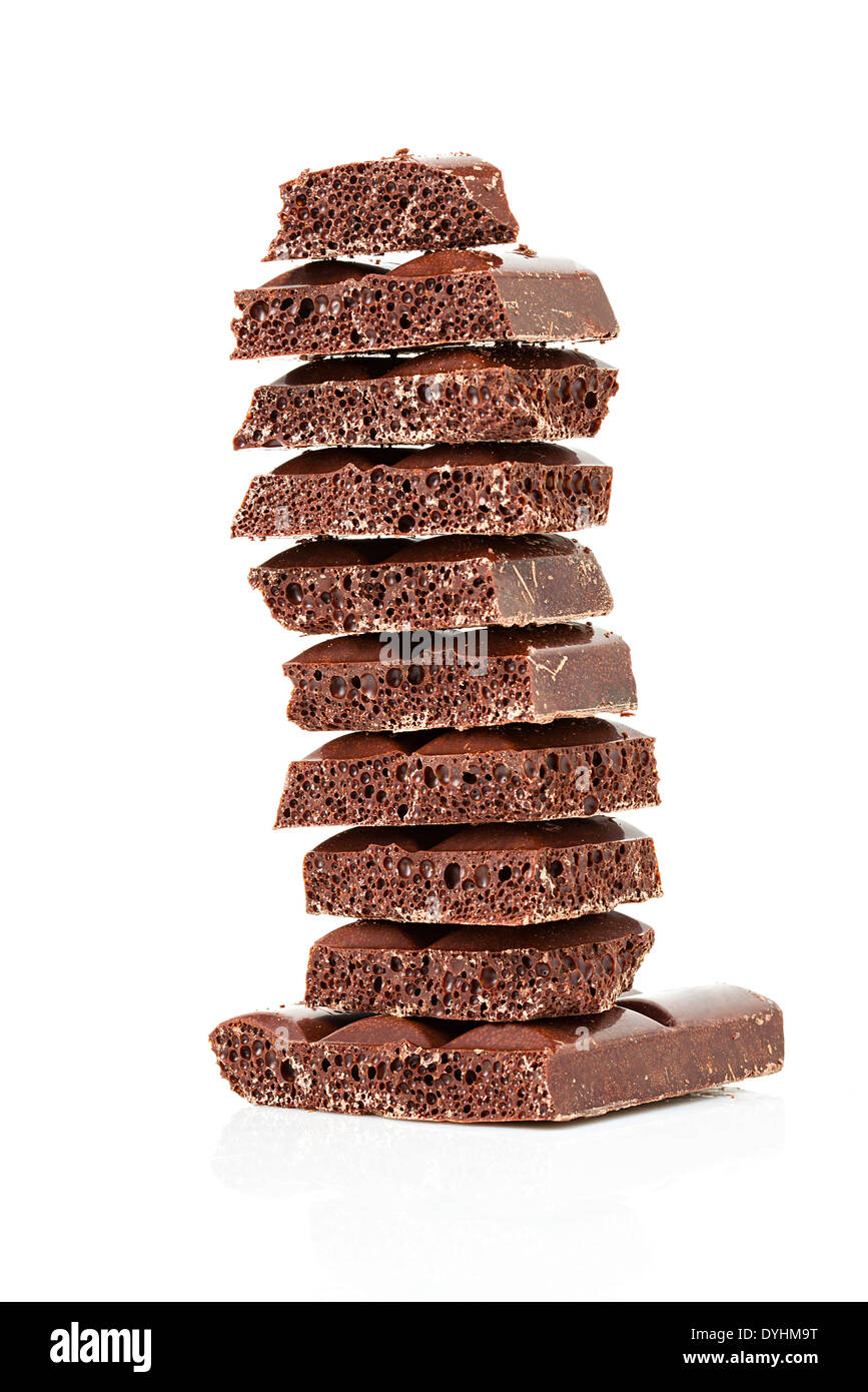 Closeup detail of chocolate parts on white background Stock Photo - Alamy