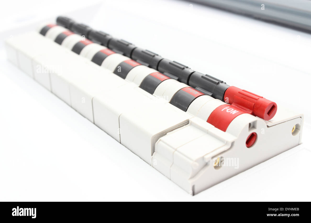 Electric switch on a white control panel Stock Photo - Alamy