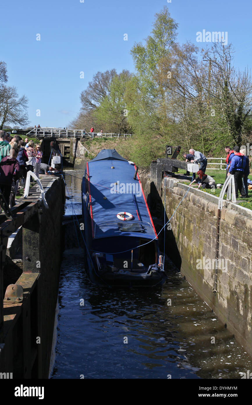 Chorley, Lancashire, Uk. 18th March 2014. Canal Barge grounded on lock ...