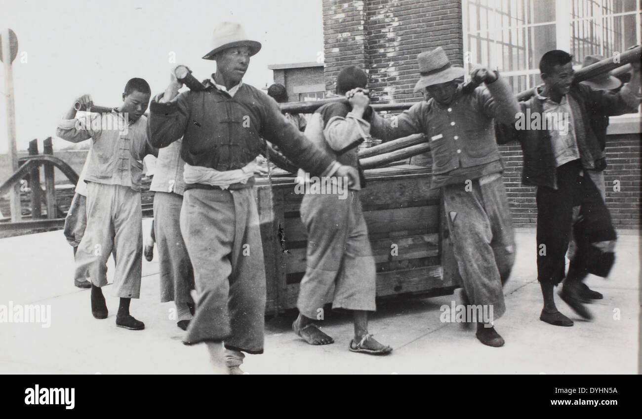 Photographs capturing workers transporting materials within an ...