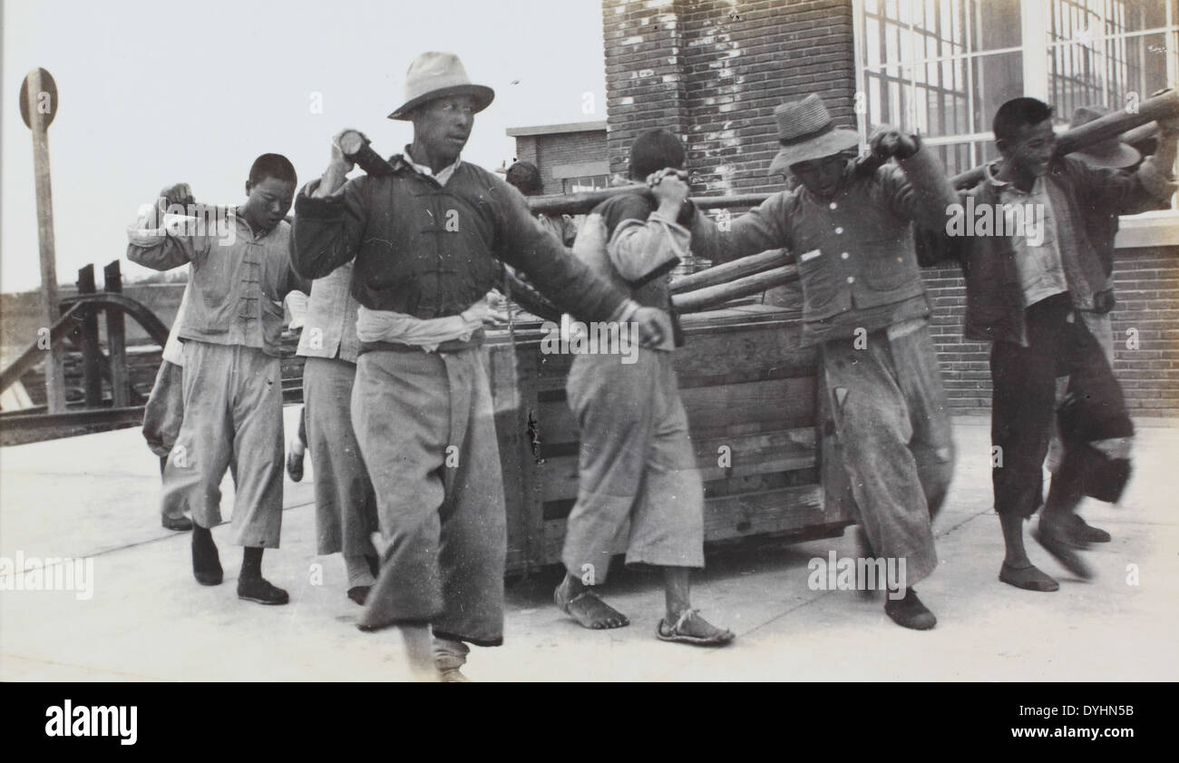 This image depicts workers transporting materials for aircraft ...