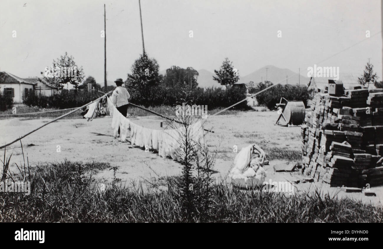 A photograph capturing a person with a clothesline, possibly reflecting ...
