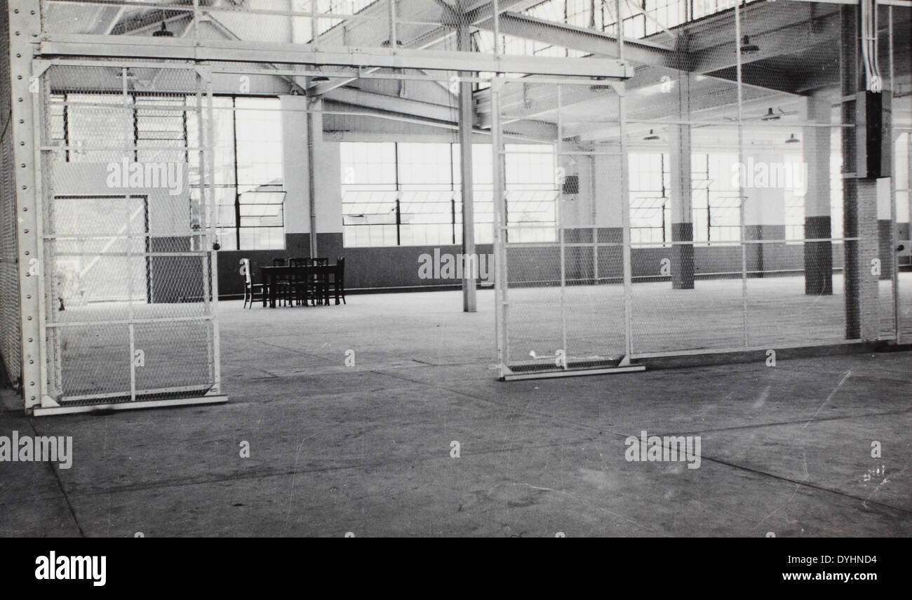 This photo captures a factory interior, possibly from the mid-20th ...