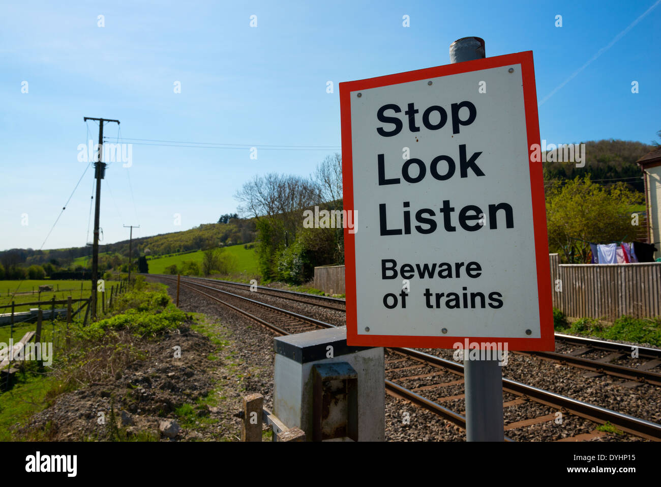 A train passes a rural farm crossing in the Shropshire village of ...