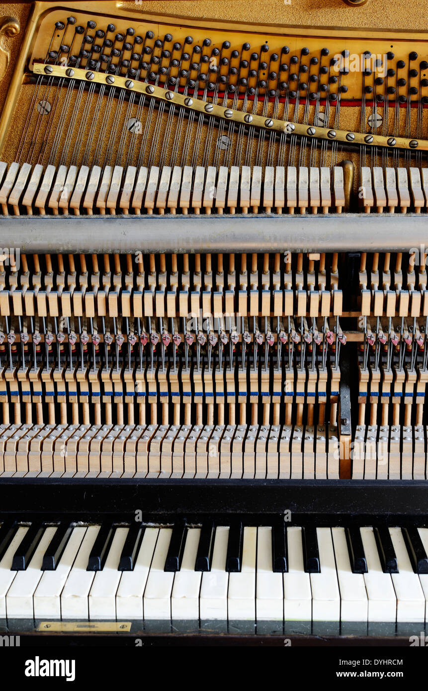 inside the piano: string, pins, keys and hammers Stock Photo - Alamy