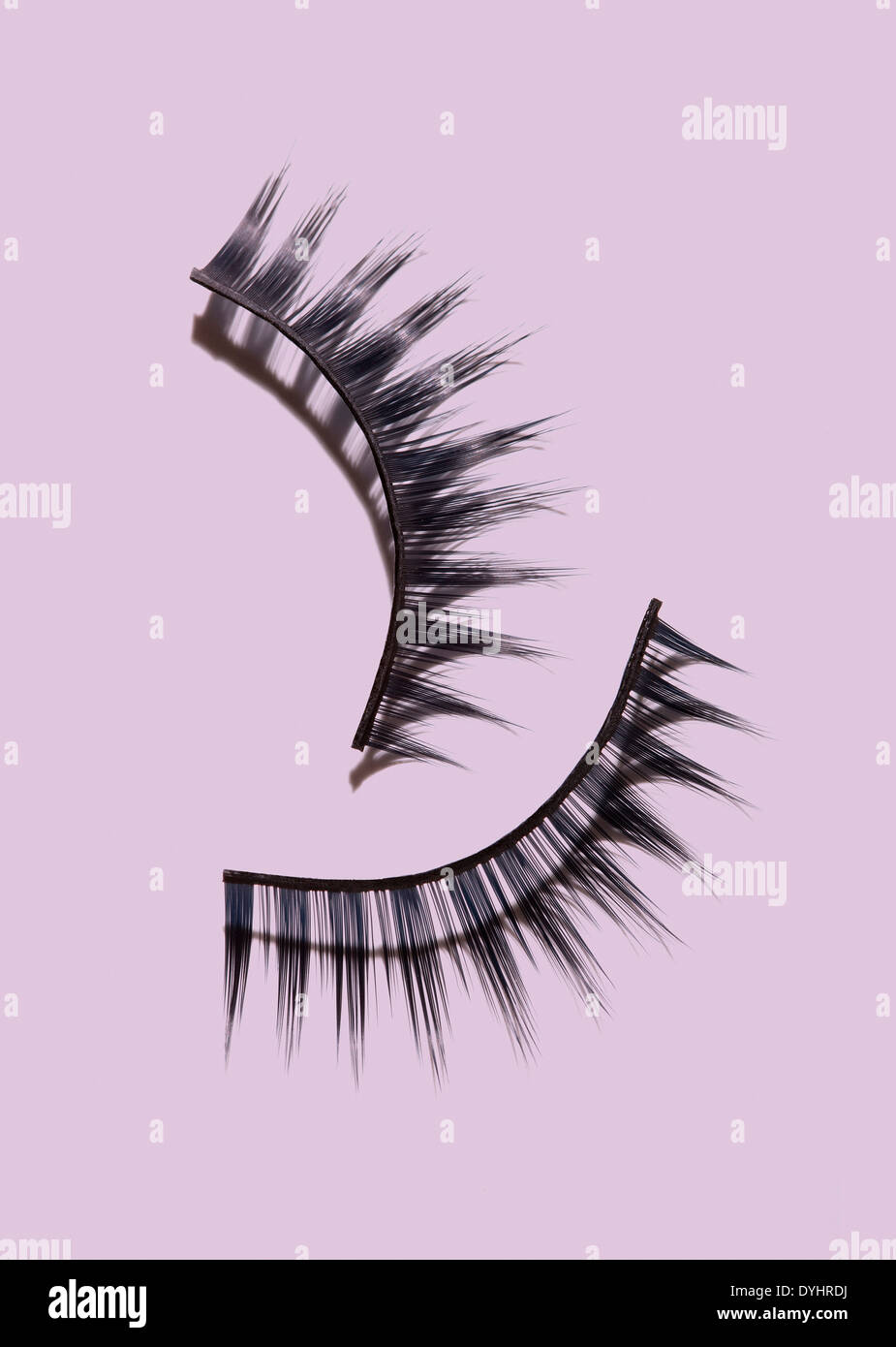 Fake Eyelashes on Purple Background Stock Photo - Alamy
