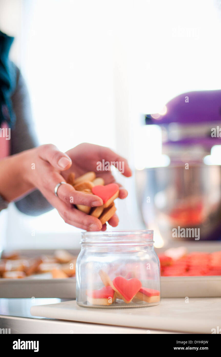 Woman holding cookie jar cookies hi-res stock photography and images ...
