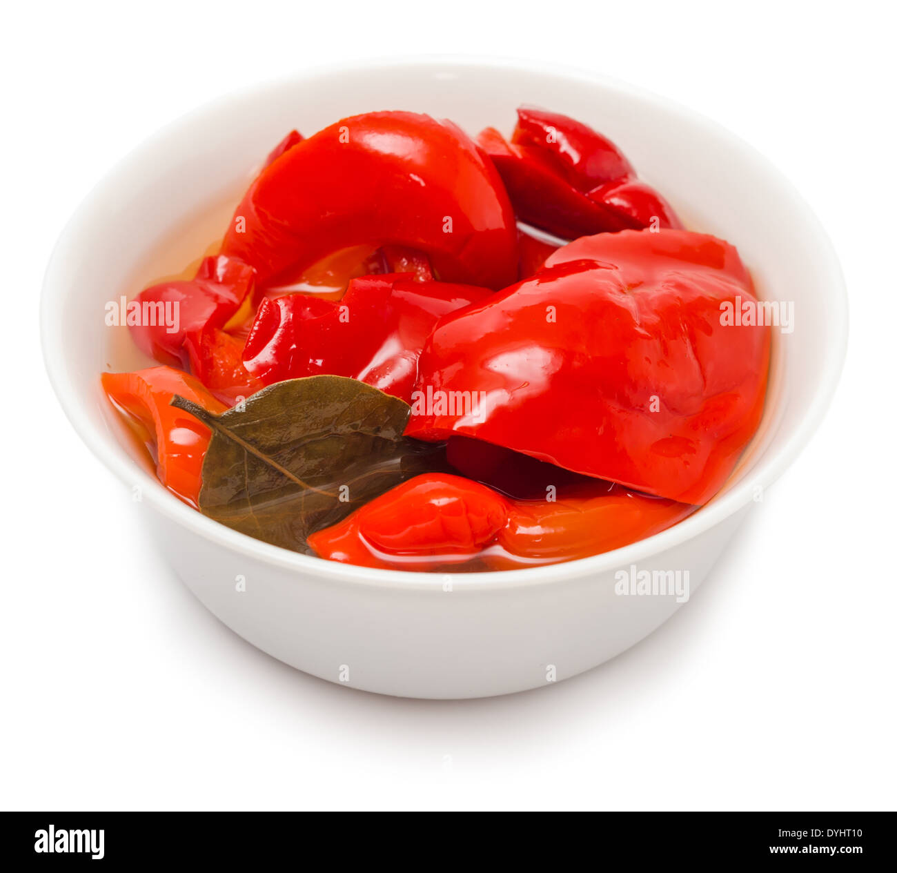 Pickled sweet red peppers in bowl isolated on white background Stock ...