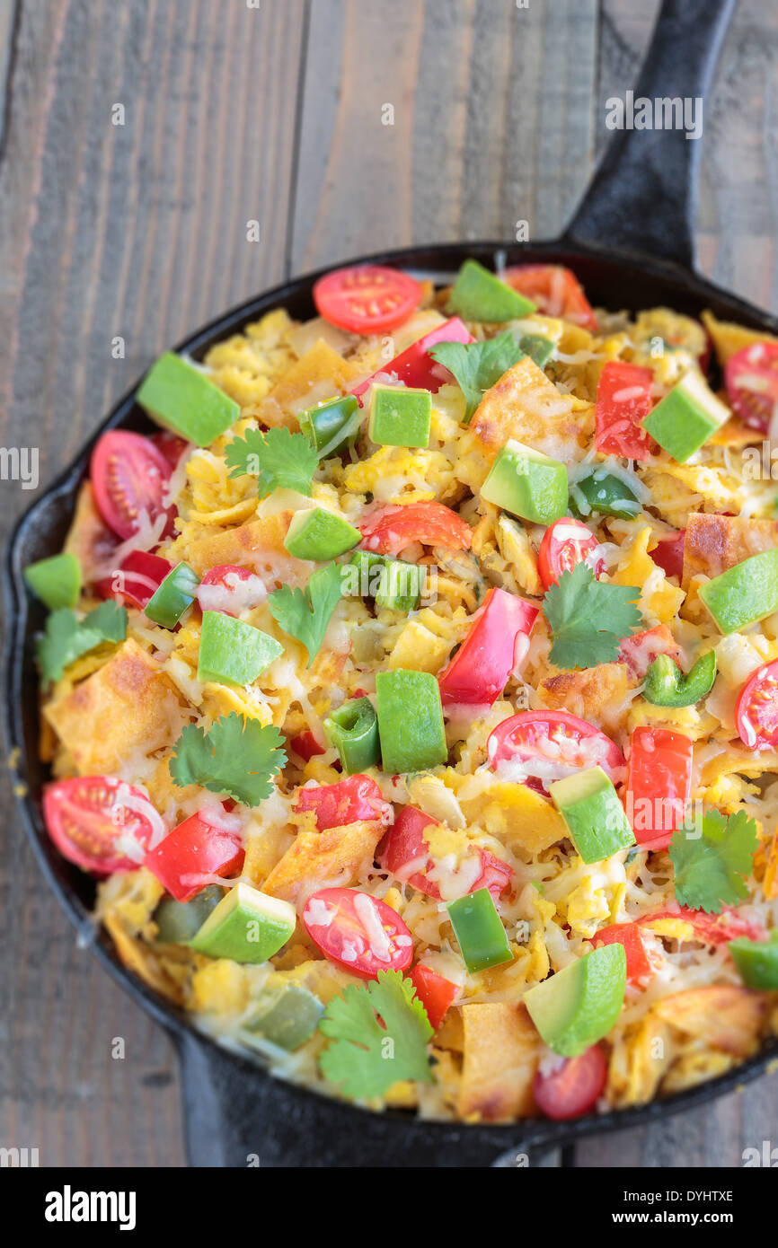 Tex-Mex breakfast migas made of eggs scrambled with onions, red bell ...