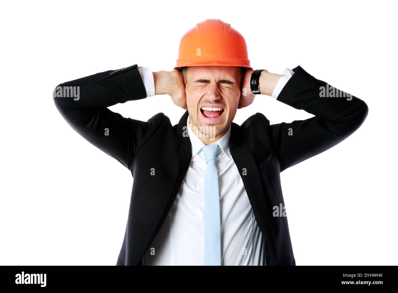 Businessman in helmet covering his ears over white background Stock ...