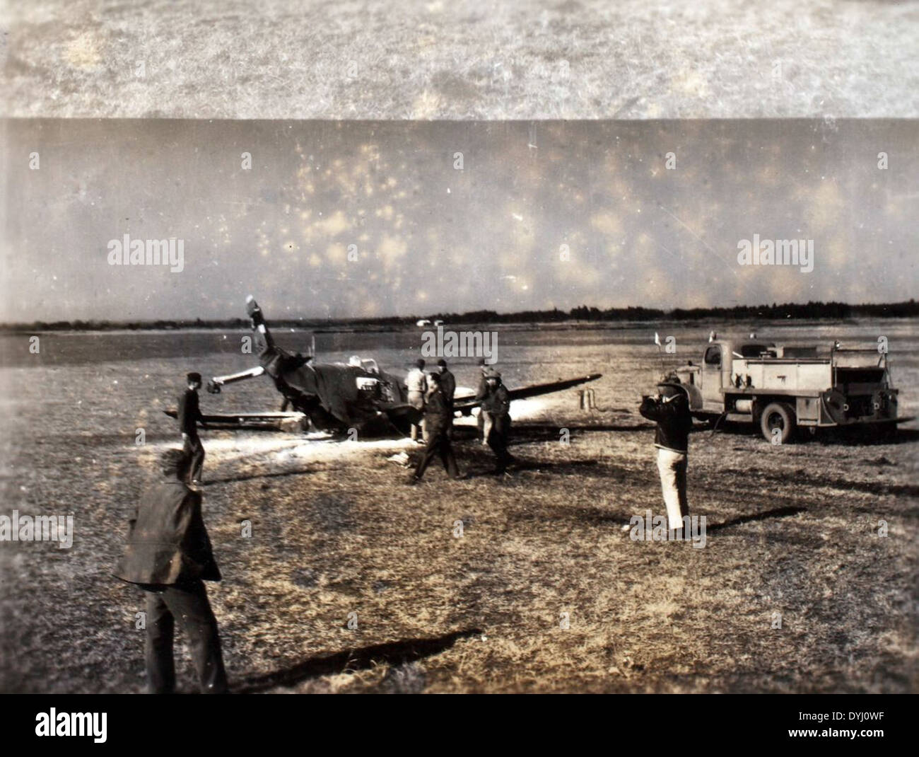 This photo shows the aftermath of a crash involving a P-51 Mustang, an ...