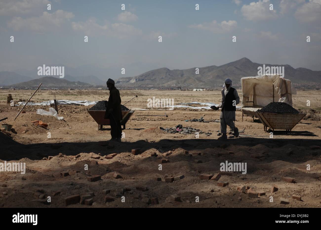Kabul, Afghanistan. 19th Apr, 2014. Afghan labors work at a brick ...