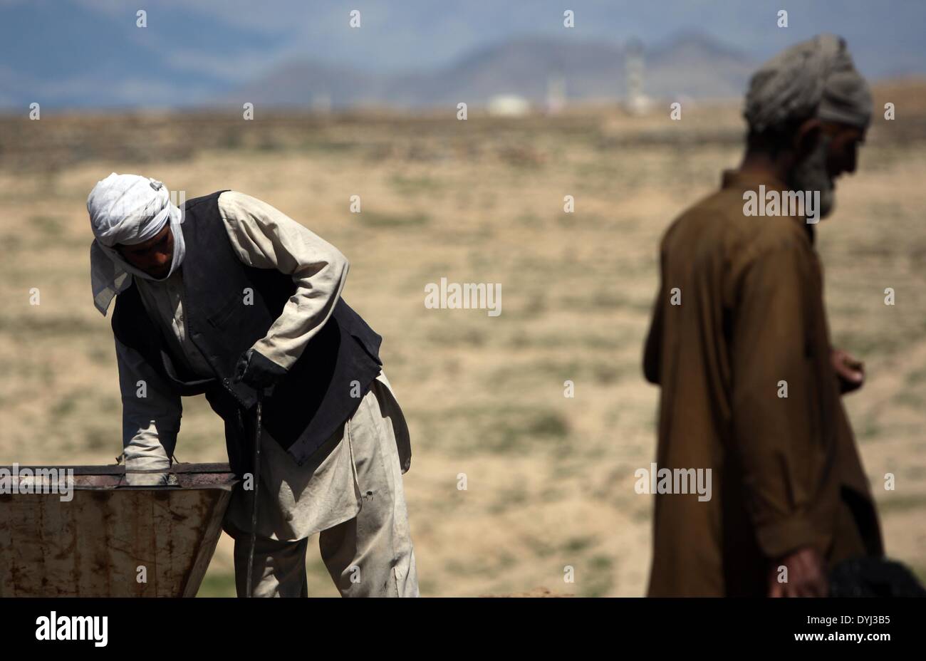 Kabul, Afghanistan. 19th Apr, 2014. Afghan labors work at a brick ...