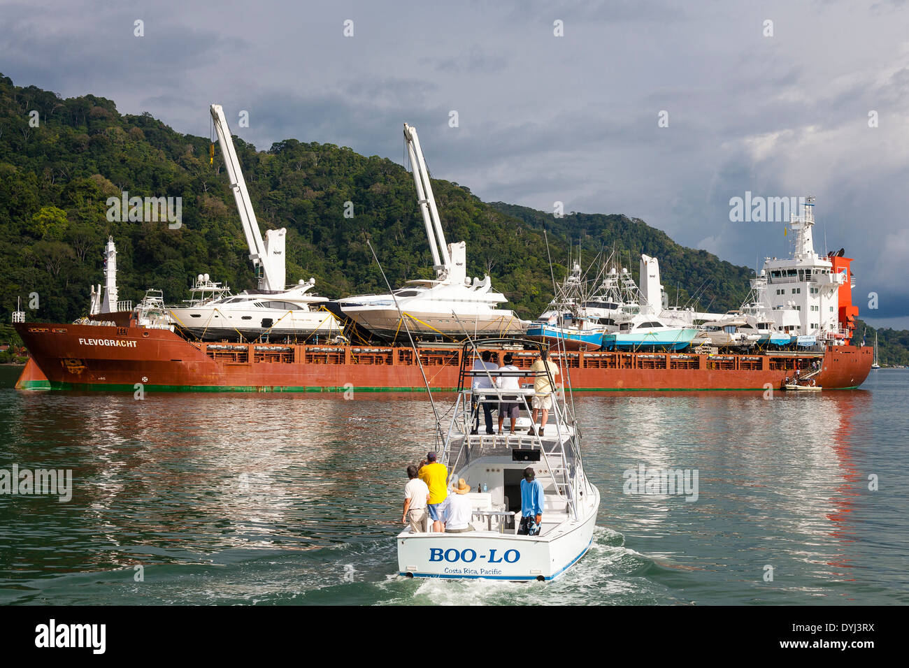 Watching a Sevenstar cargo ship carrying yachts strapped down as deck ...