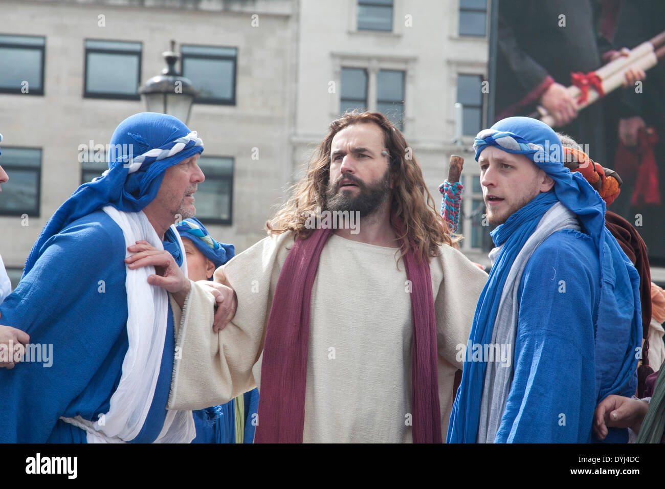 London UK. 18th April 2014. James Burke-Dunsmore (C) plays Jesus of ...