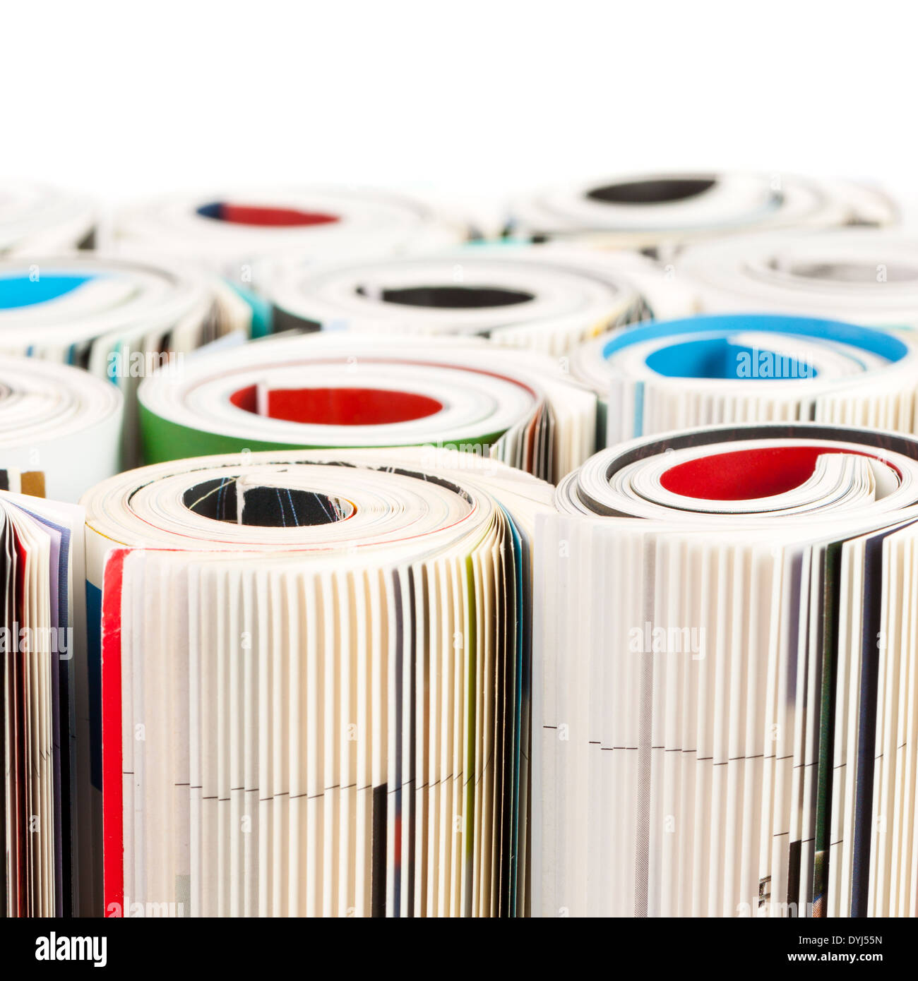 Stack of color magazines on white background Stock Photo - Alamy