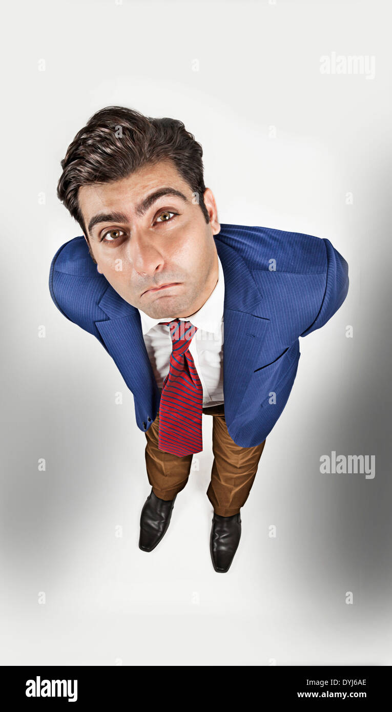 Sad man looking up in perspective Stock Photo - Alamy