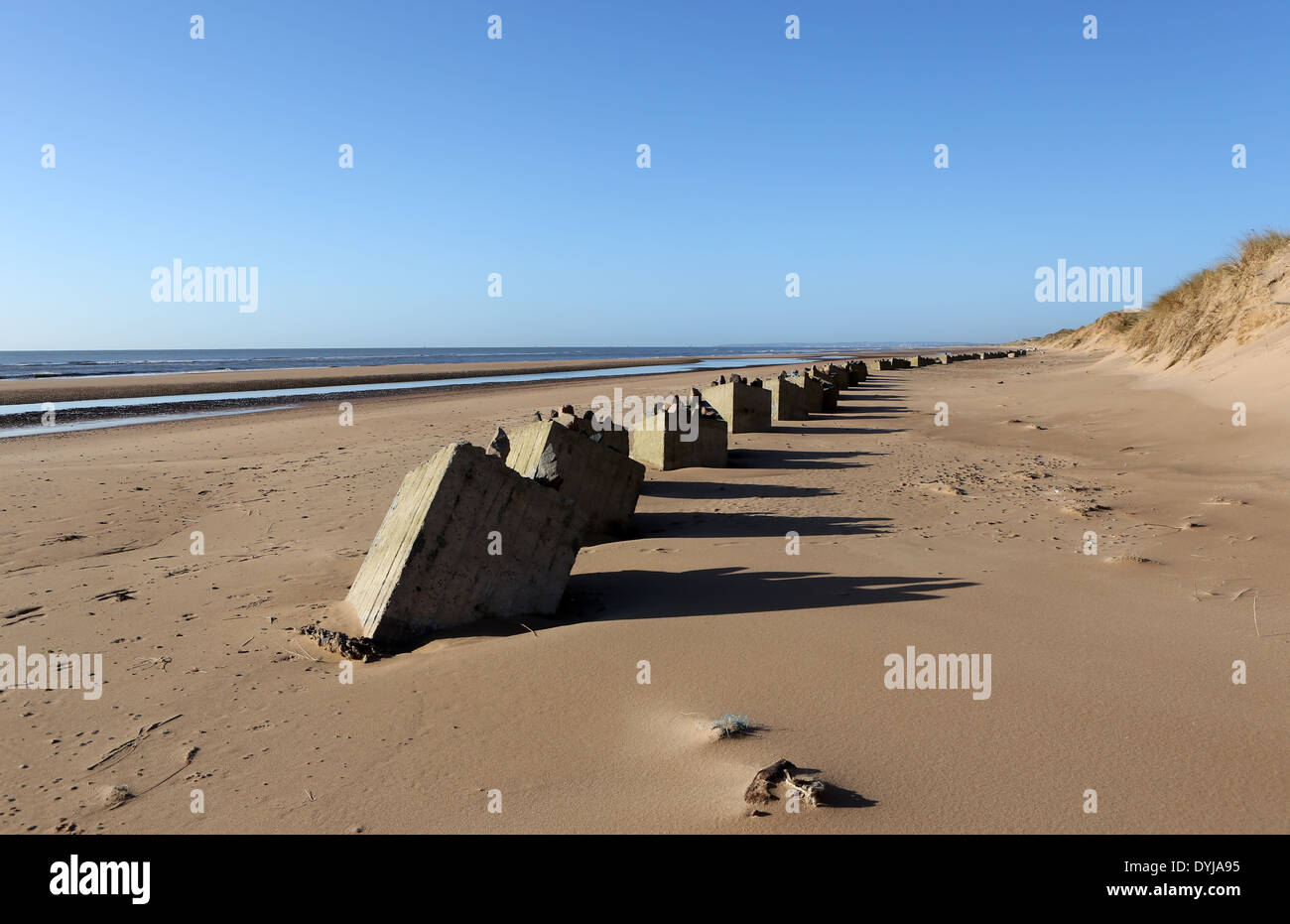 World War 2 dragons teeth tank traps at the beach in the village of ...
