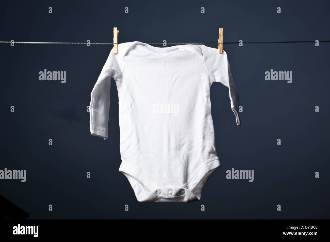 Washing line with baby clothing hi-res stock photography and images - Alamy