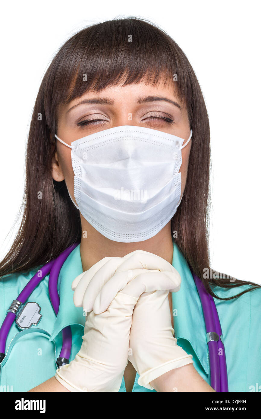 praying female medical doctor with mask isolated Stock Photo - Alamy