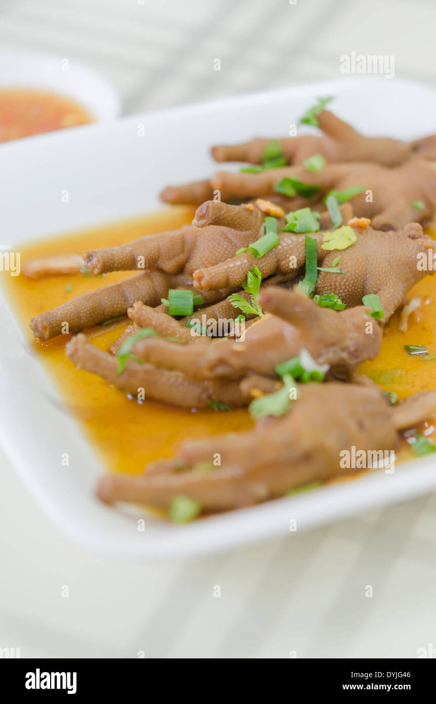 Chinese stewed chicken feet placed on a white plate Stock Photo - Alamy