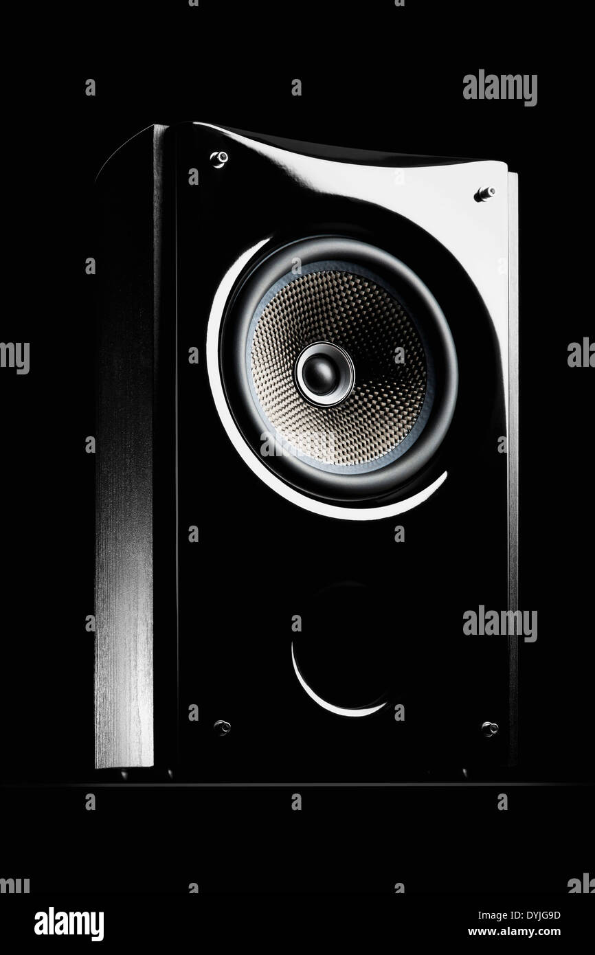 Audio speaker on a black background Stock Photo - Alamy