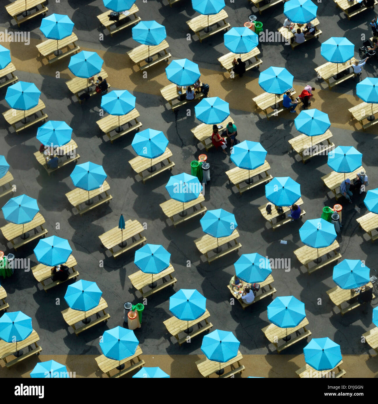 Aerial view looking down on colourful blue parasols shade for people at ...