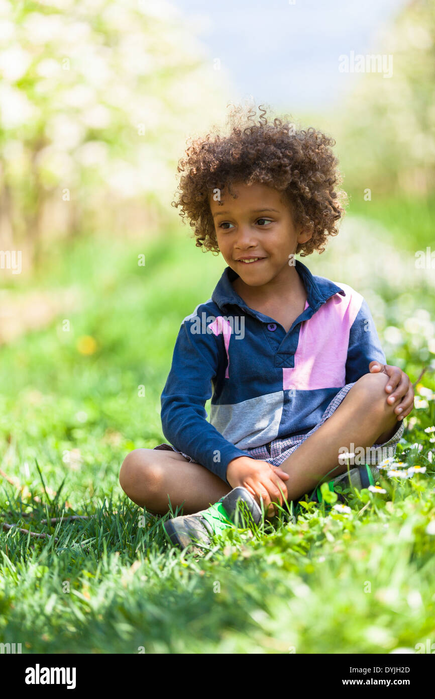 Cute african american little boy playing outdoor - Black people Stock ...