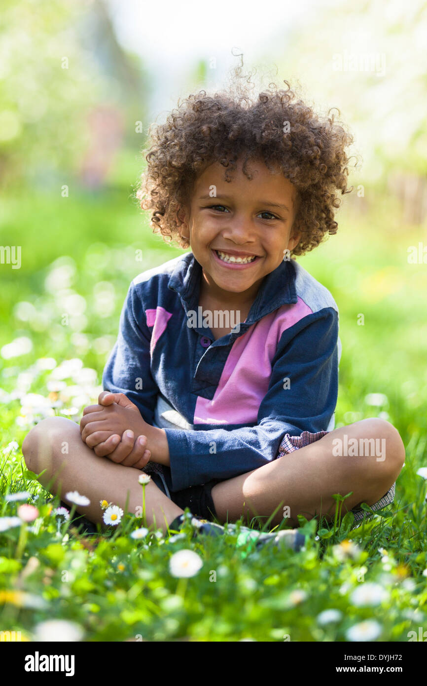 Cute african american little boy playing outdoor - Black people Stock ...