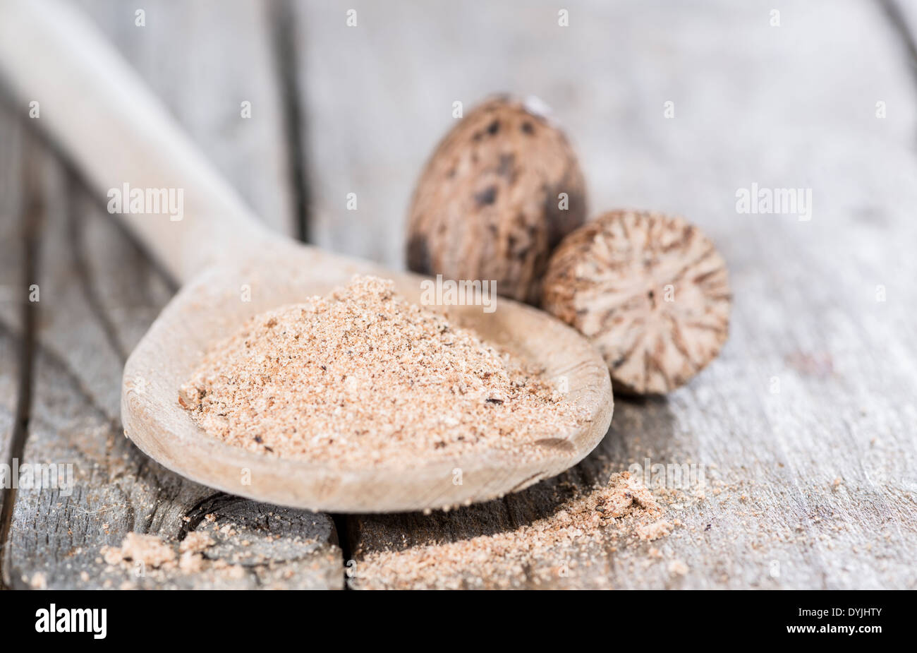 Wooden spoon with Nutmeg Powder (close-up shot Stock Photo - Alamy