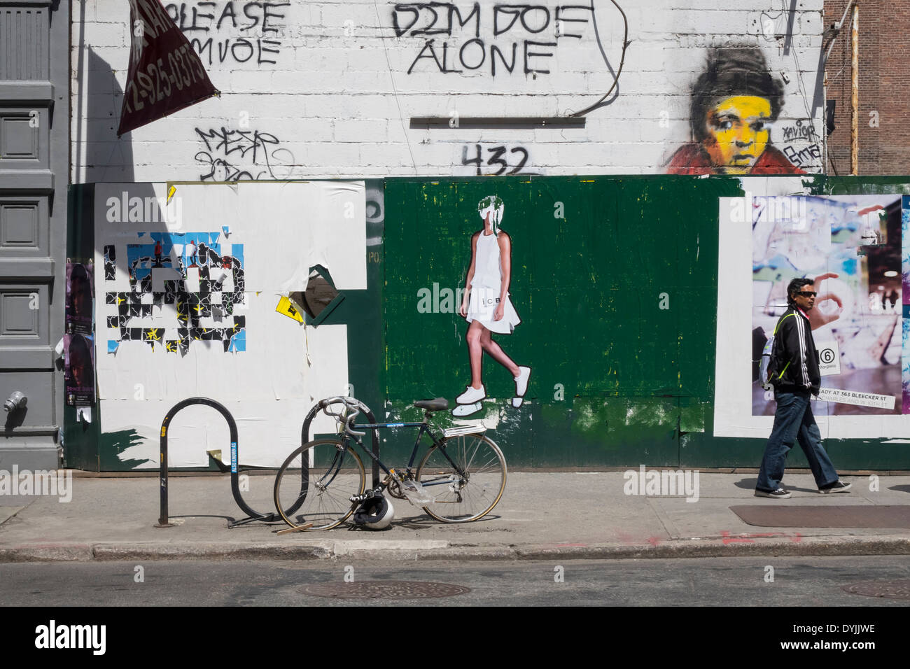 Graffiti and faded poster ads in New York City Stock Photo - Alamy