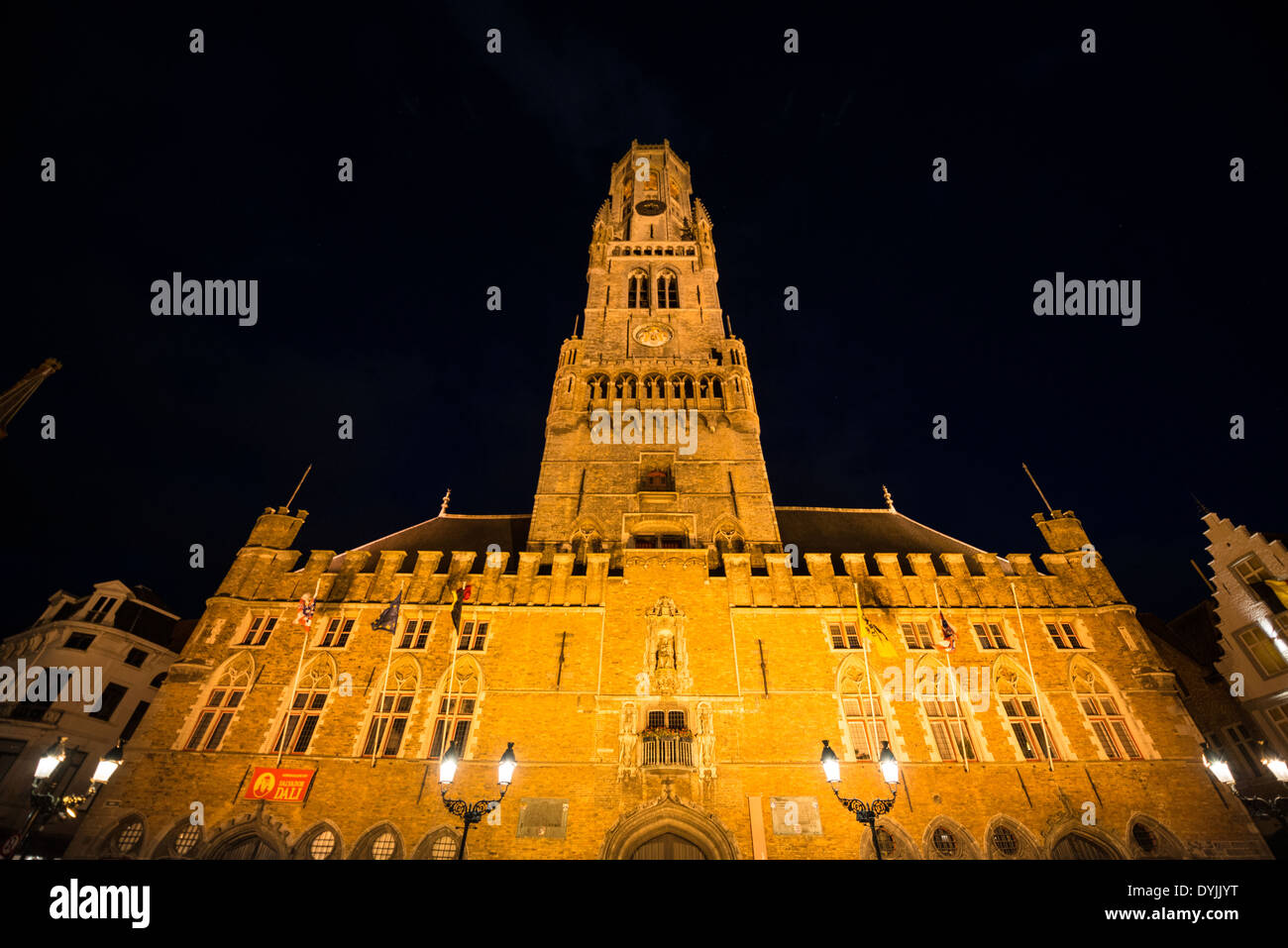 The historic Belfry clock tower at night in the Markt (Market Square ...