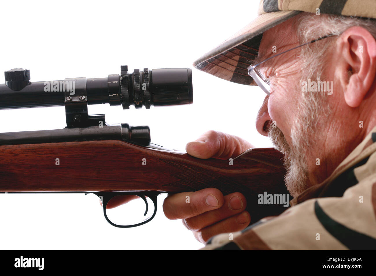 Hunter looking into the scope of his riffle Stock Photo - Alamy