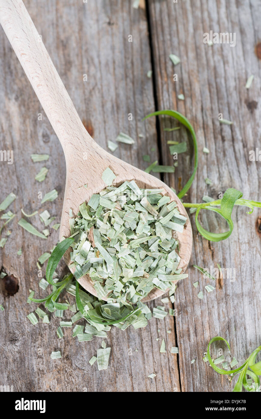 Wooden spoon with a portion of dried Tarragon (close-up shot Stock ...
