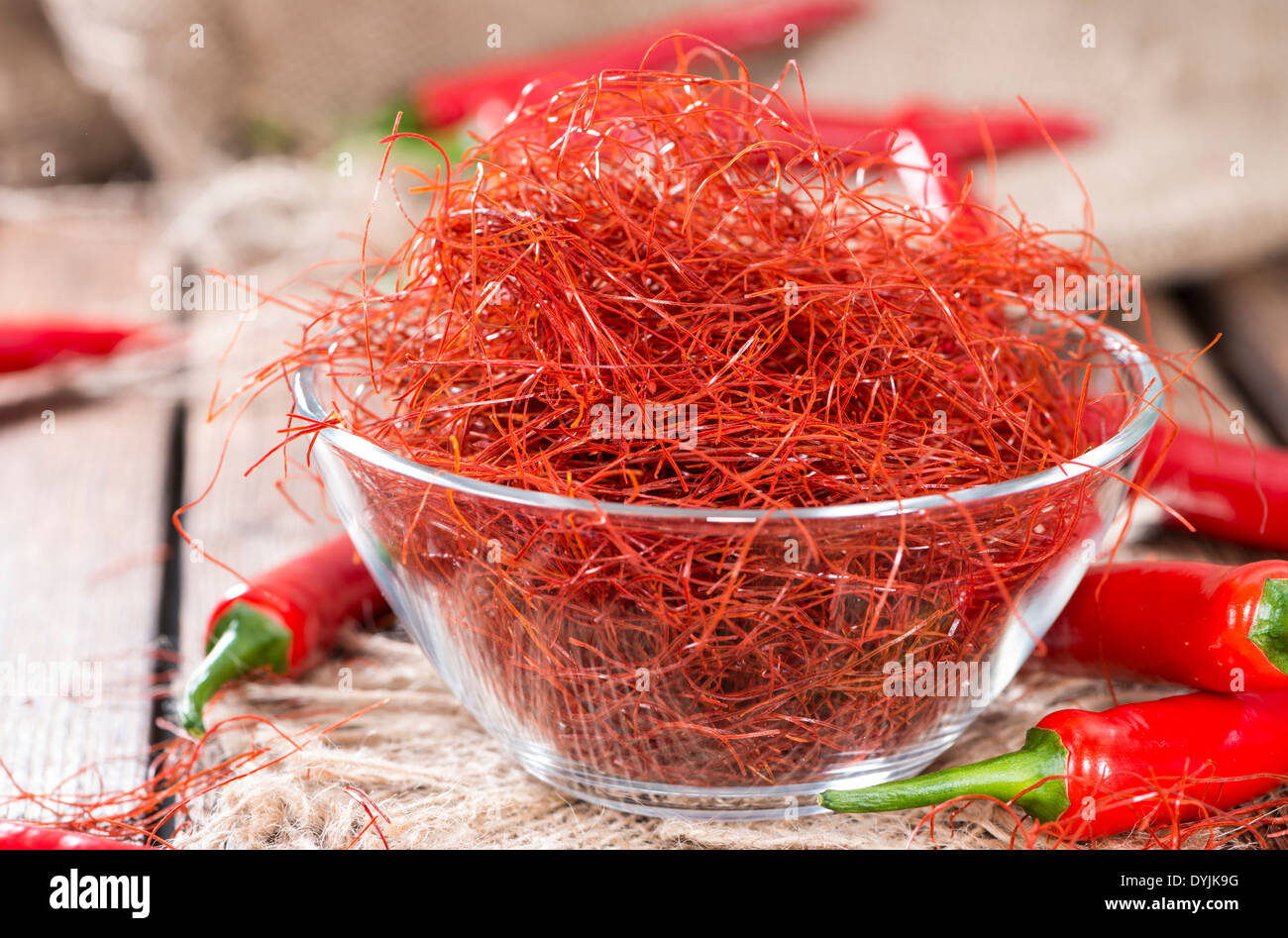 Hot red Chilli Strings on vintage wooden background Stock Photo - Alamy