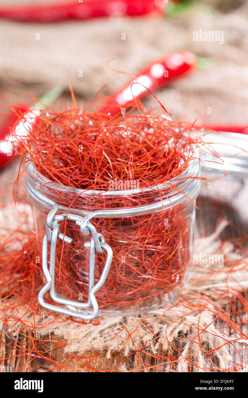 Small portion of dried Chilli Strings on wooden background Stock Photo ...