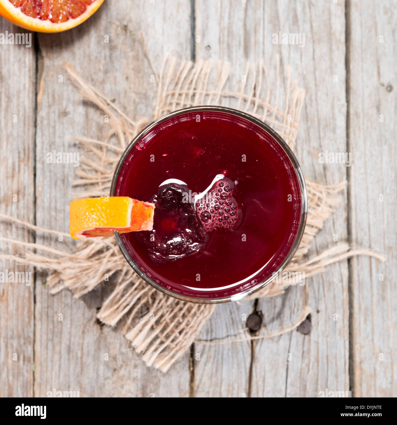 Glass with fresh made Blood Orange Juice and some ice cubes Stock Photo ...