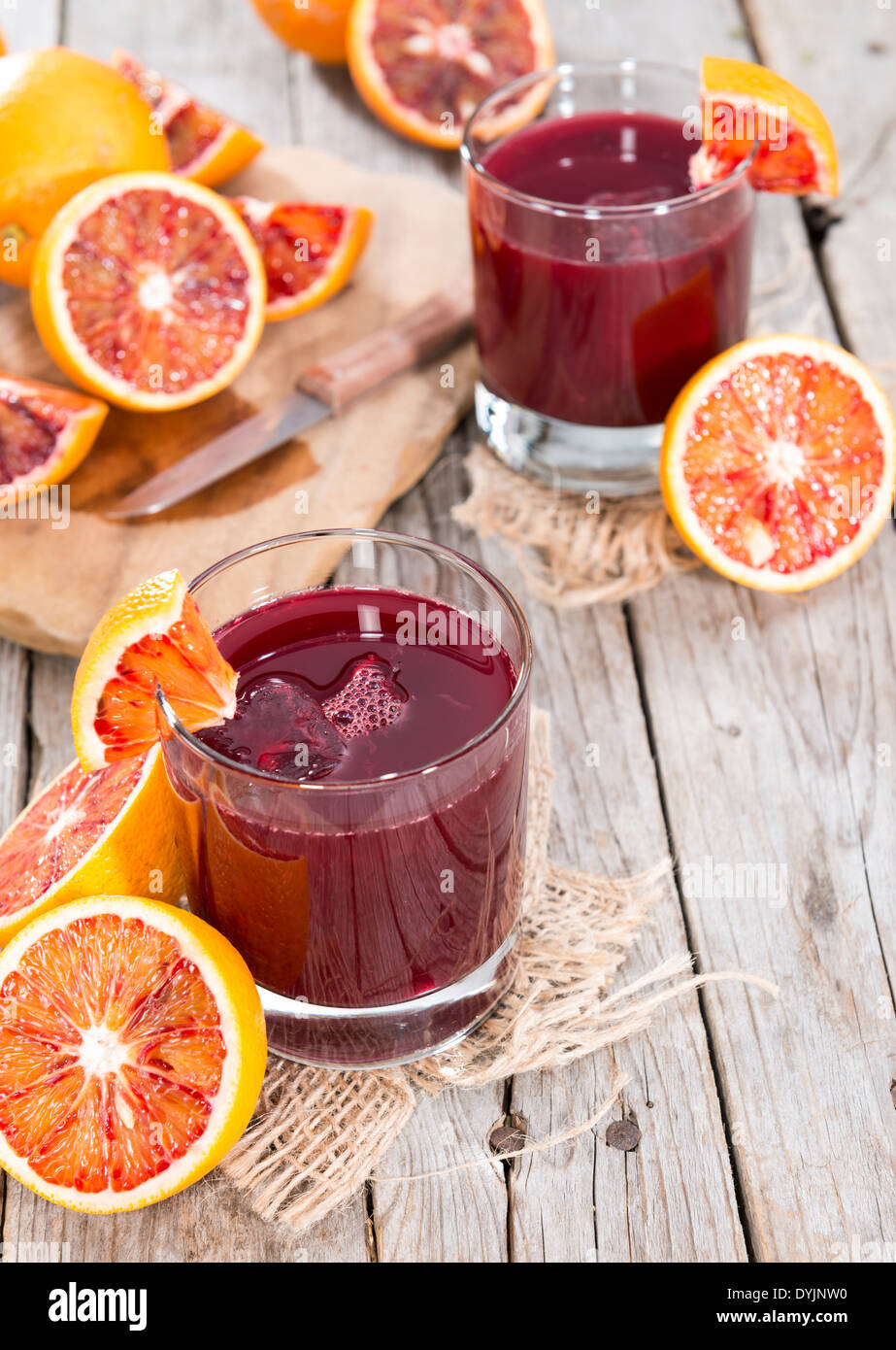 Glass with fresh made Blood Orange Juice and some ice cubes Stock Photo ...