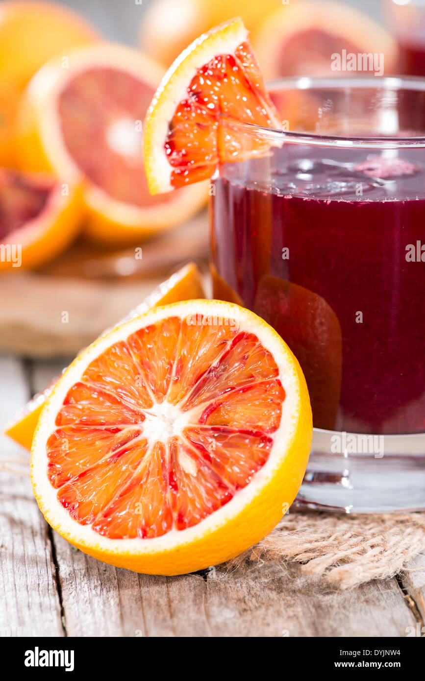 Glass with fresh made Blood Orange Juice and some ice cubes Stock Photo ...