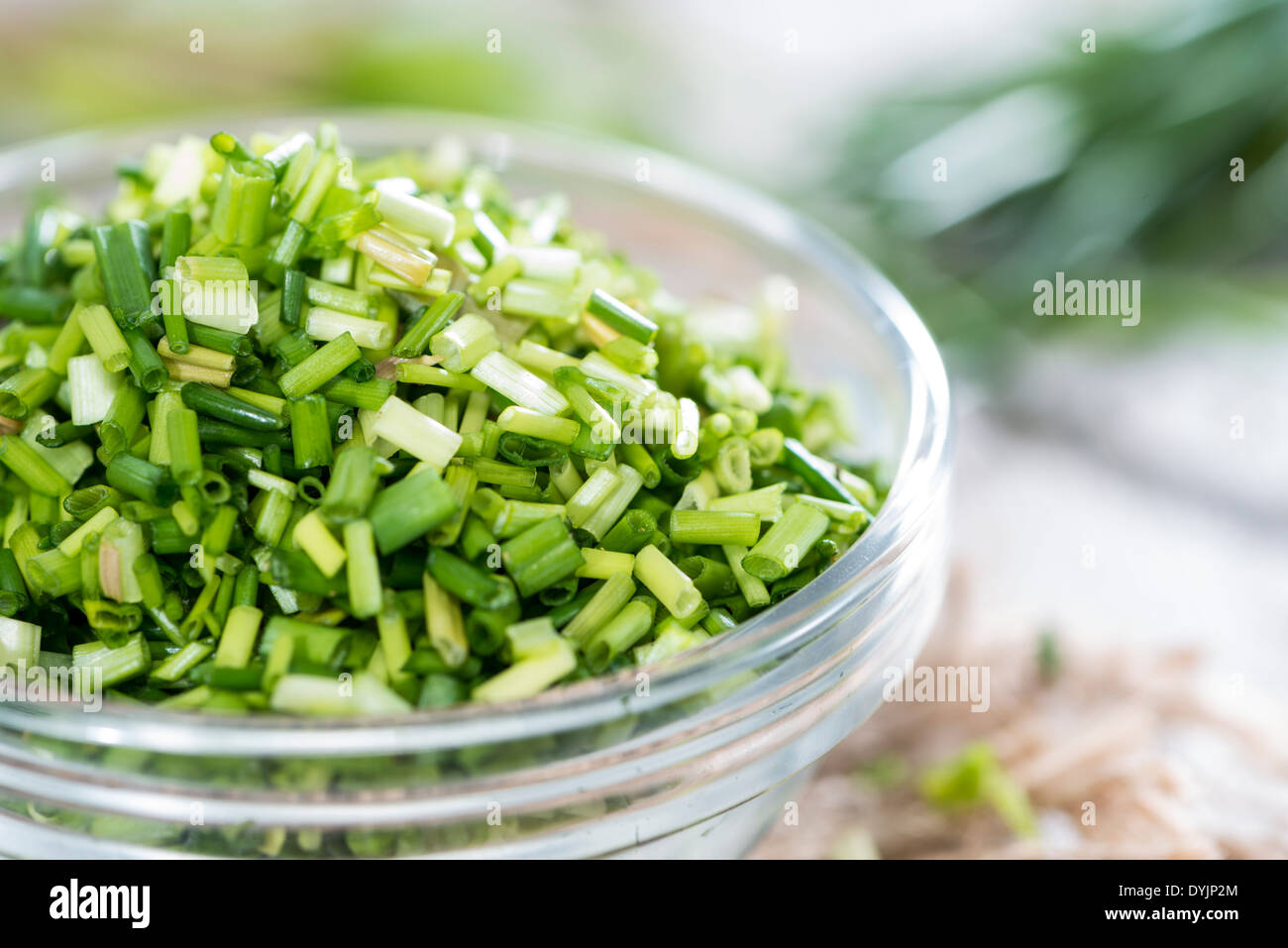 Small portion of fresh cutted Chive on vintage background Stock Photo ...