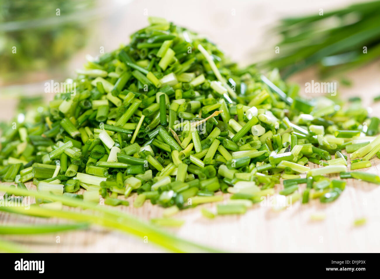 Small portion of fresh cutted Chive on vintage background Stock Photo ...