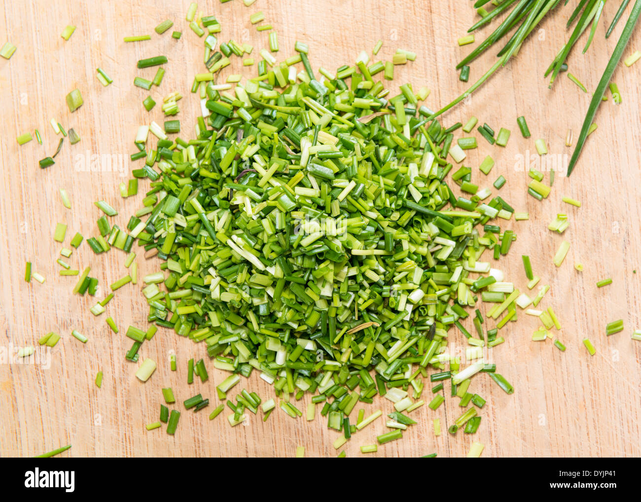 Small portion of fresh cutted Chive on vintage background Stock Photo ...