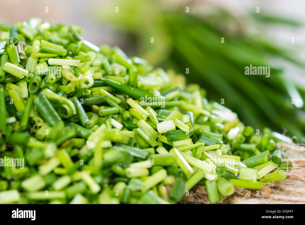 Small portion of fresh cutted Chive on vintage background Stock Photo ...