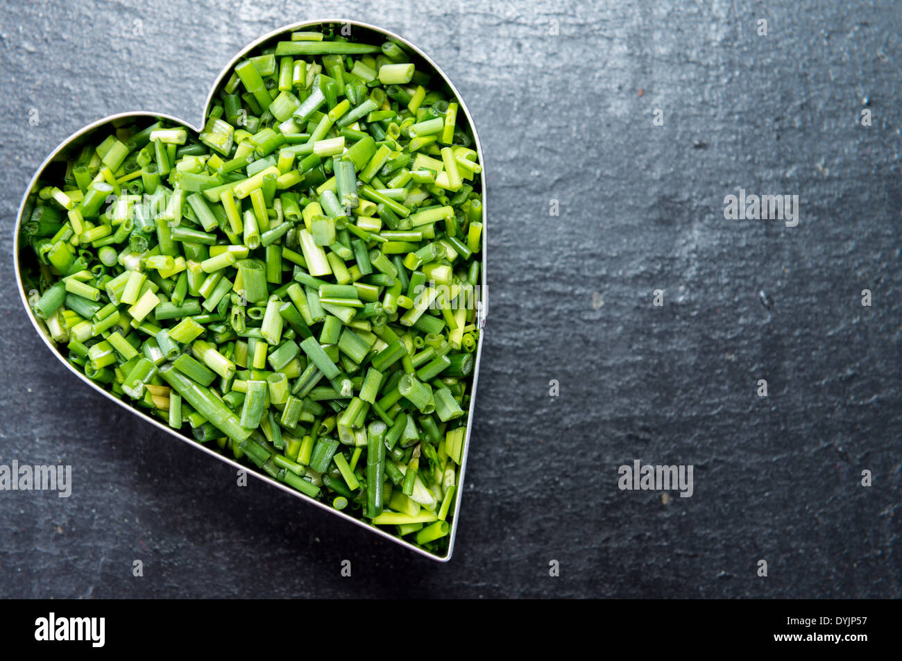 Heart shapes filled with fresh cutted Chive (I love herbs concept Stock ...