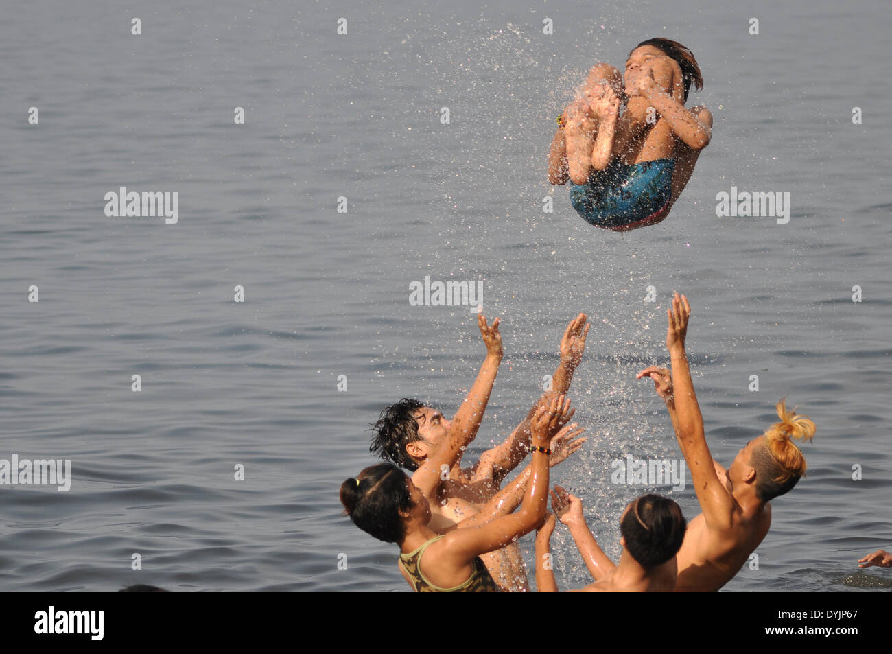 Manila, Philippines. 20th April, 2014. A Filipino boy sommersaults over ...