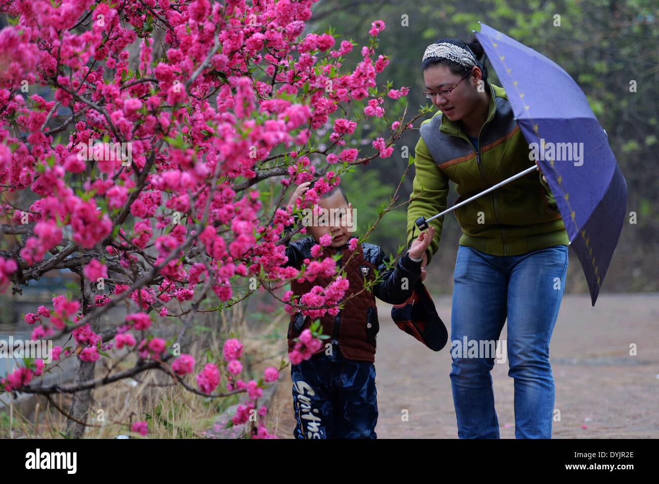 Lanzhou, China's Gansu Province. 20th Apr, 2014. A woman and her child ...