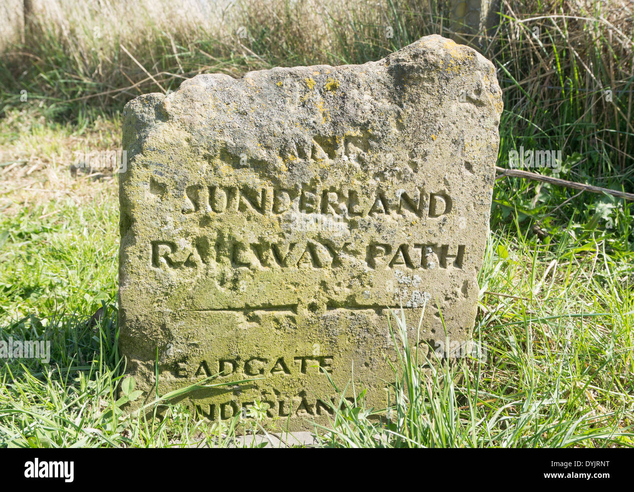 Eroded damaged stone sign marking the Consett to Sunderland railway ...