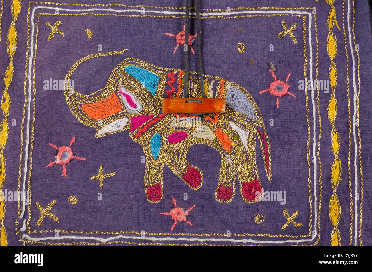 Handcrafted fabric with an embroidered elephant Stock Photo - Alamy