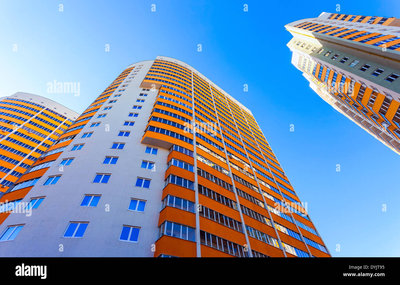 Tall apartment buildings on blue sky background Stock Photo - Alamy