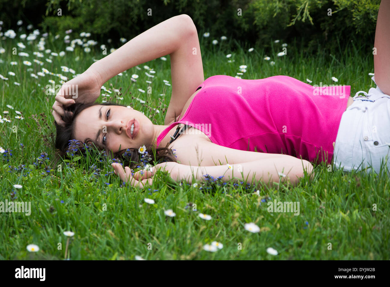 Beautiful woman laying down flowers hi-res stock photography and images ...